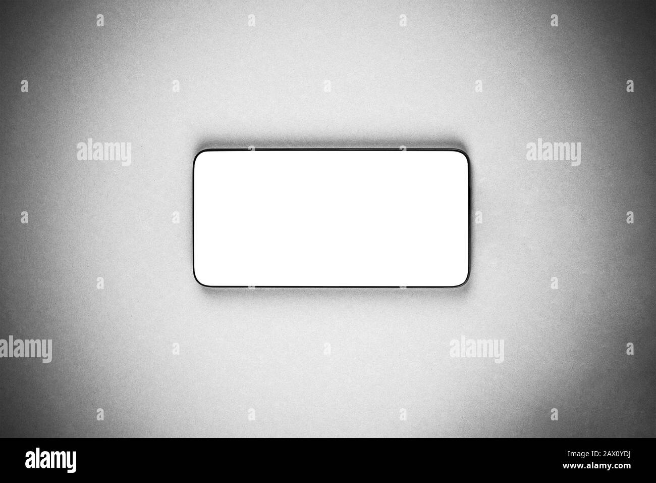 mock-up new smartphone with a white screen close up top view, black and ...