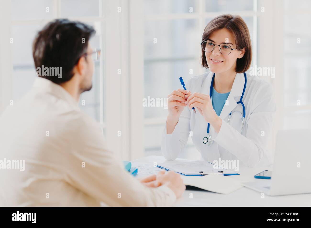 Male patient visits doctor at clinic, tells about his problems, talk ...