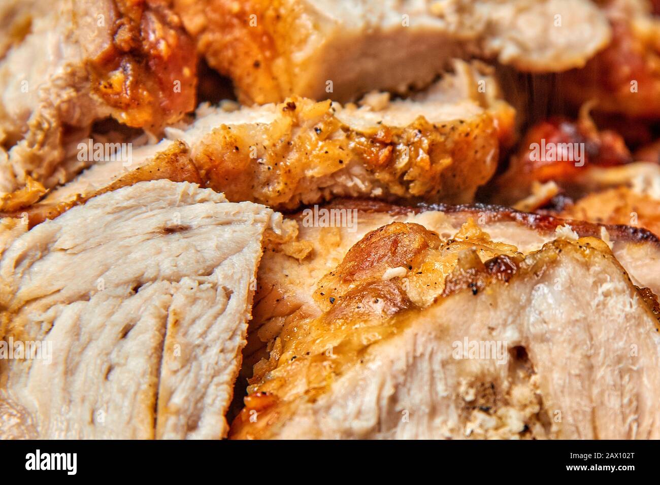 baked meat cut into pieces close up photo Stock Photo - Alamy