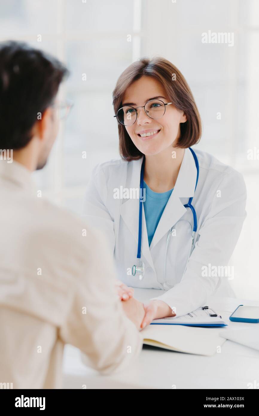 Calmly talking to patient hi-res stock photography and images - Alamy
