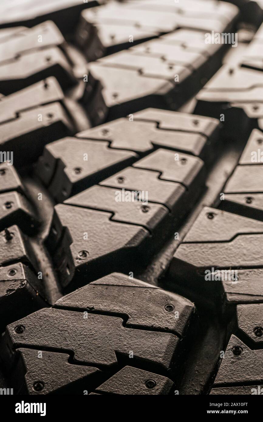 off-road all terrain tire tread close-up. Powerful ground hooks ...