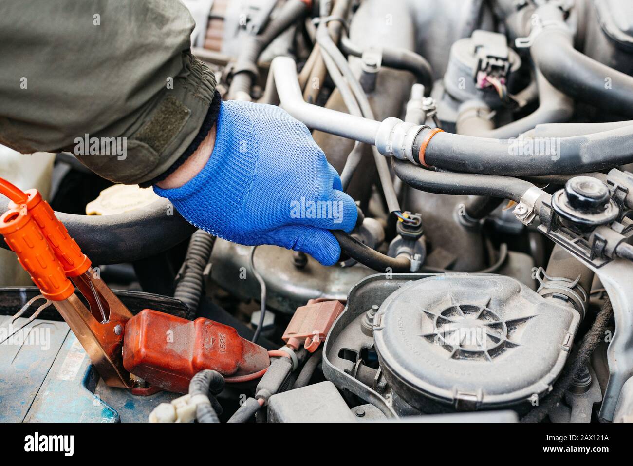 Car mechanic engineer checking, fixing the car, making maintenance ...