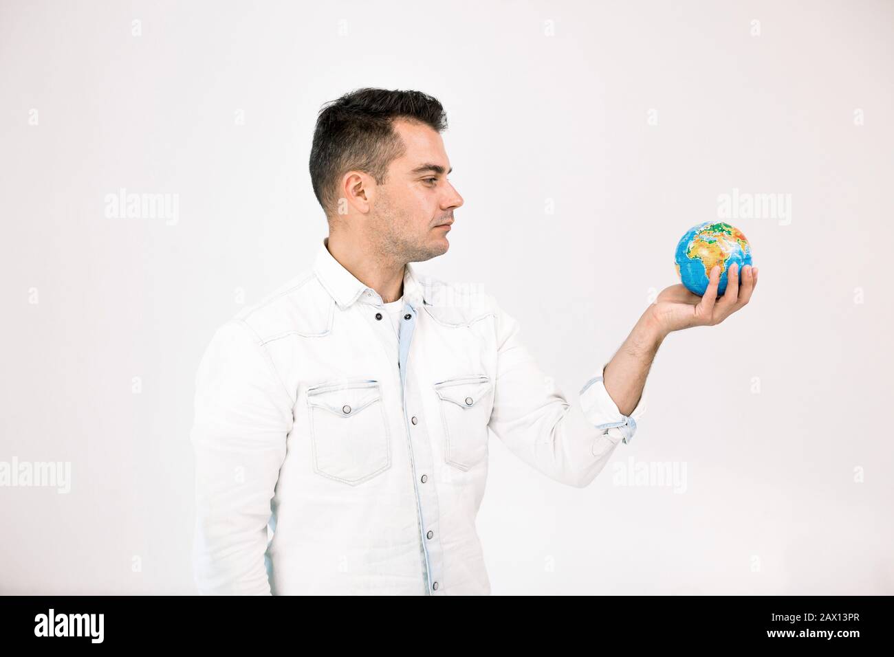 Side half-lengh portrait of handsome caucasian man in white casual ...