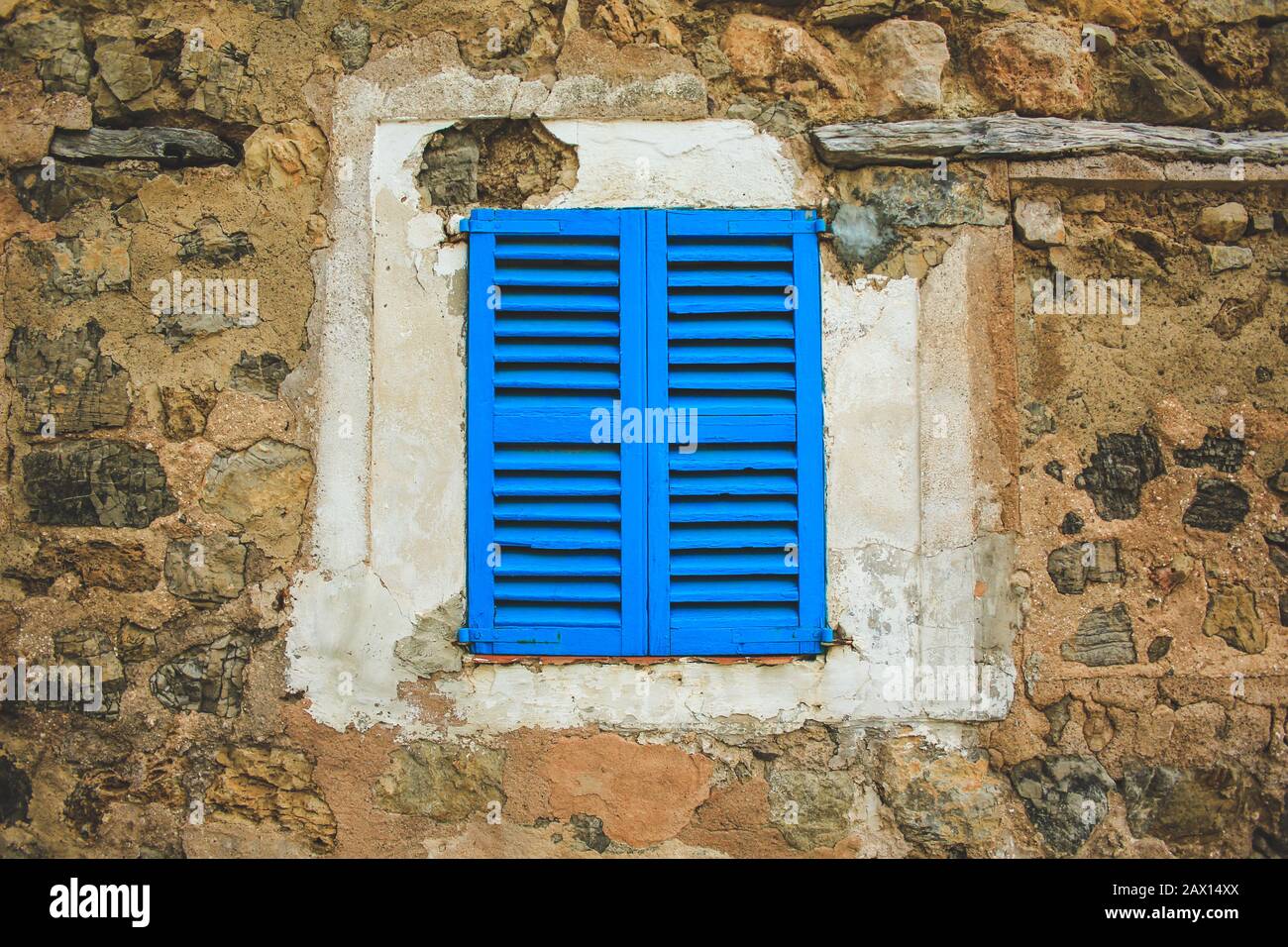 old rustic window with blue closed shutters in Mallorca, Spain Stock ...