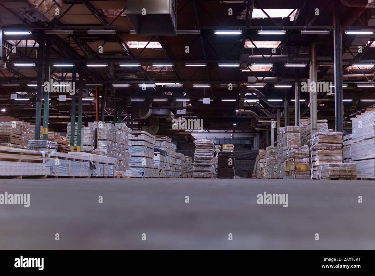 Timber Flooring Factory. Pile of cut wood in factory storage warehouse ...