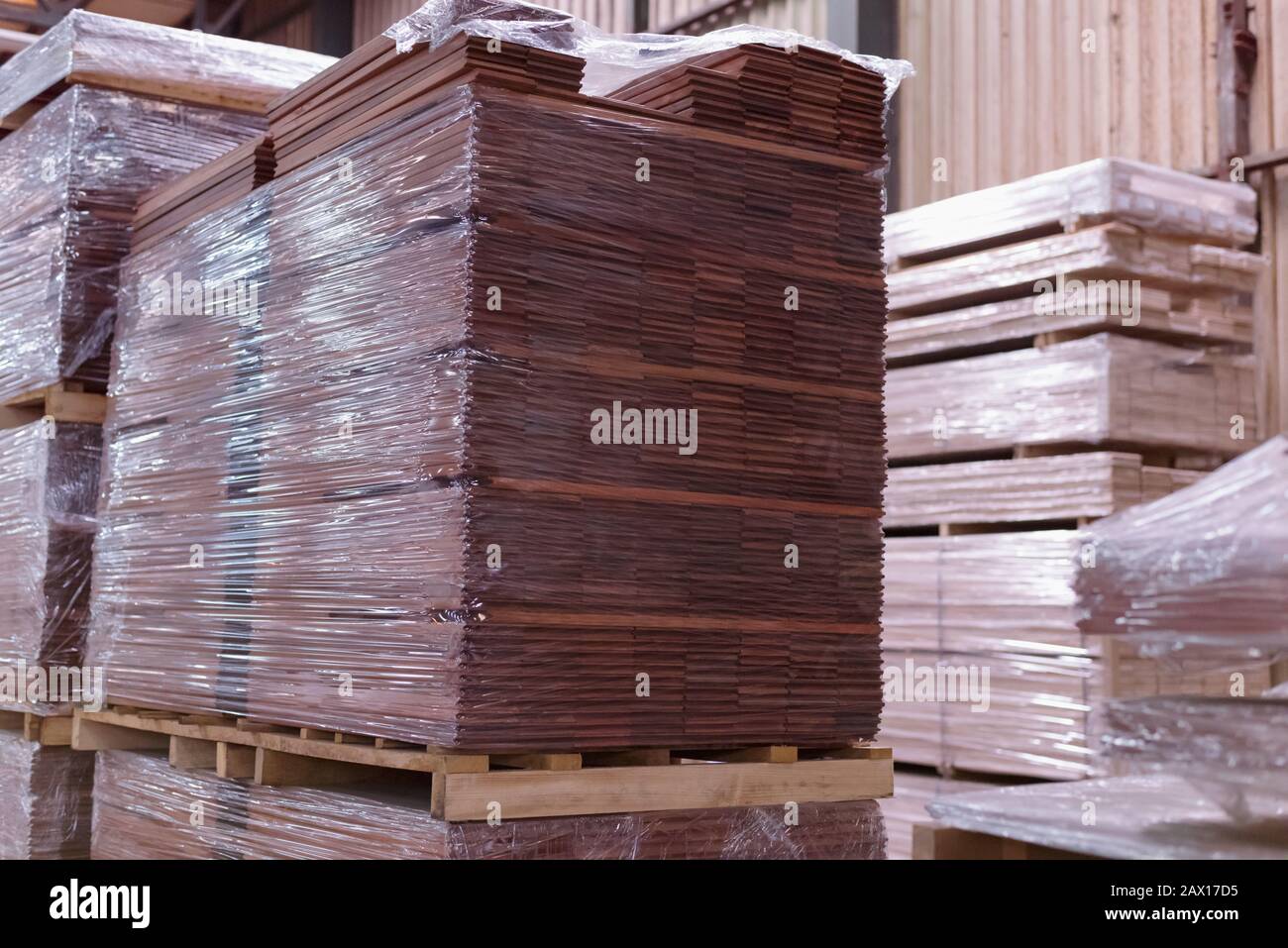 Timber Flooring Factory. Pile of cut wood in factory storage warehouse ...