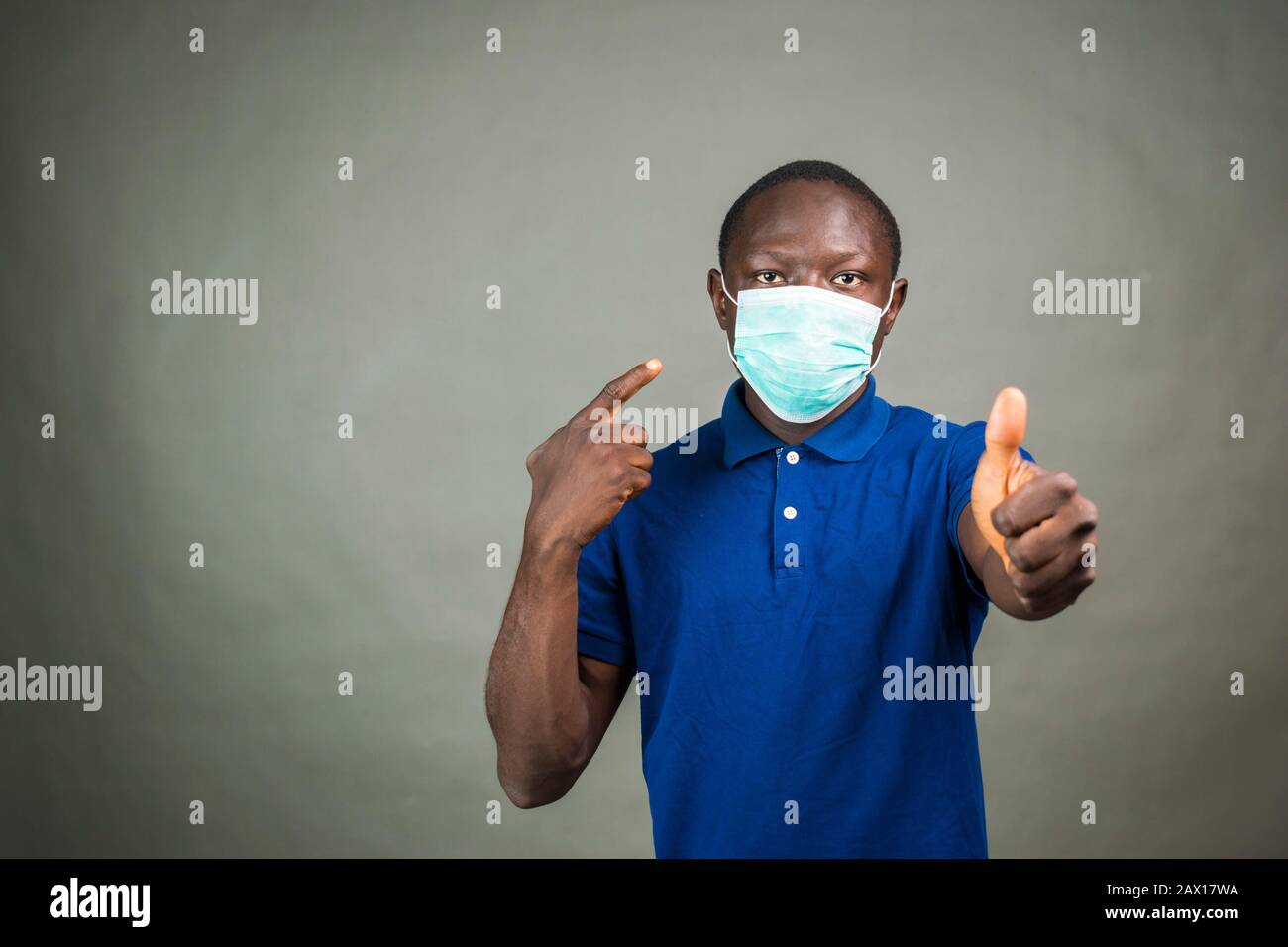 Man Face Mask Thumbs Up High Resolution Stock Photography and Images ...