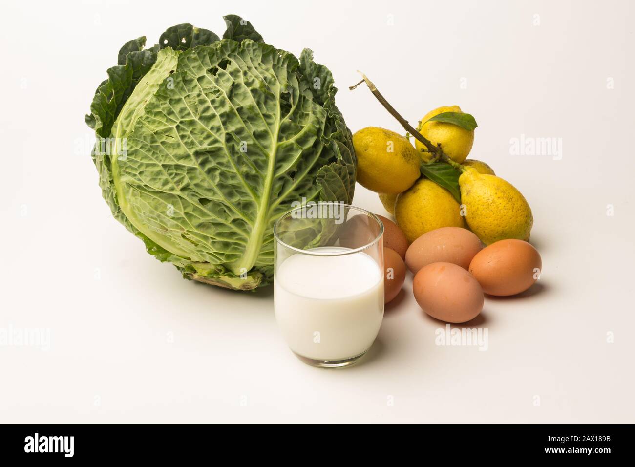 Cabbage, eggs, milk and lemons; variety of organic food brought from ...