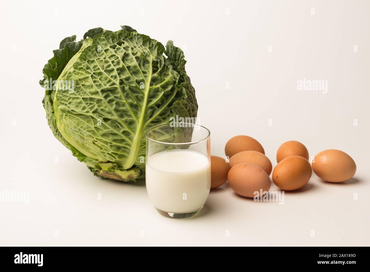 Cabbage, eggs, milk and lemons; variety of organic food brought from ...