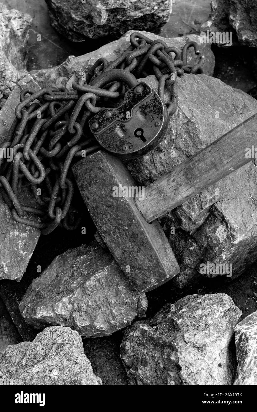 Rusty chain on the brickwork. The symbol of slave labor Stock Photo - Alamy