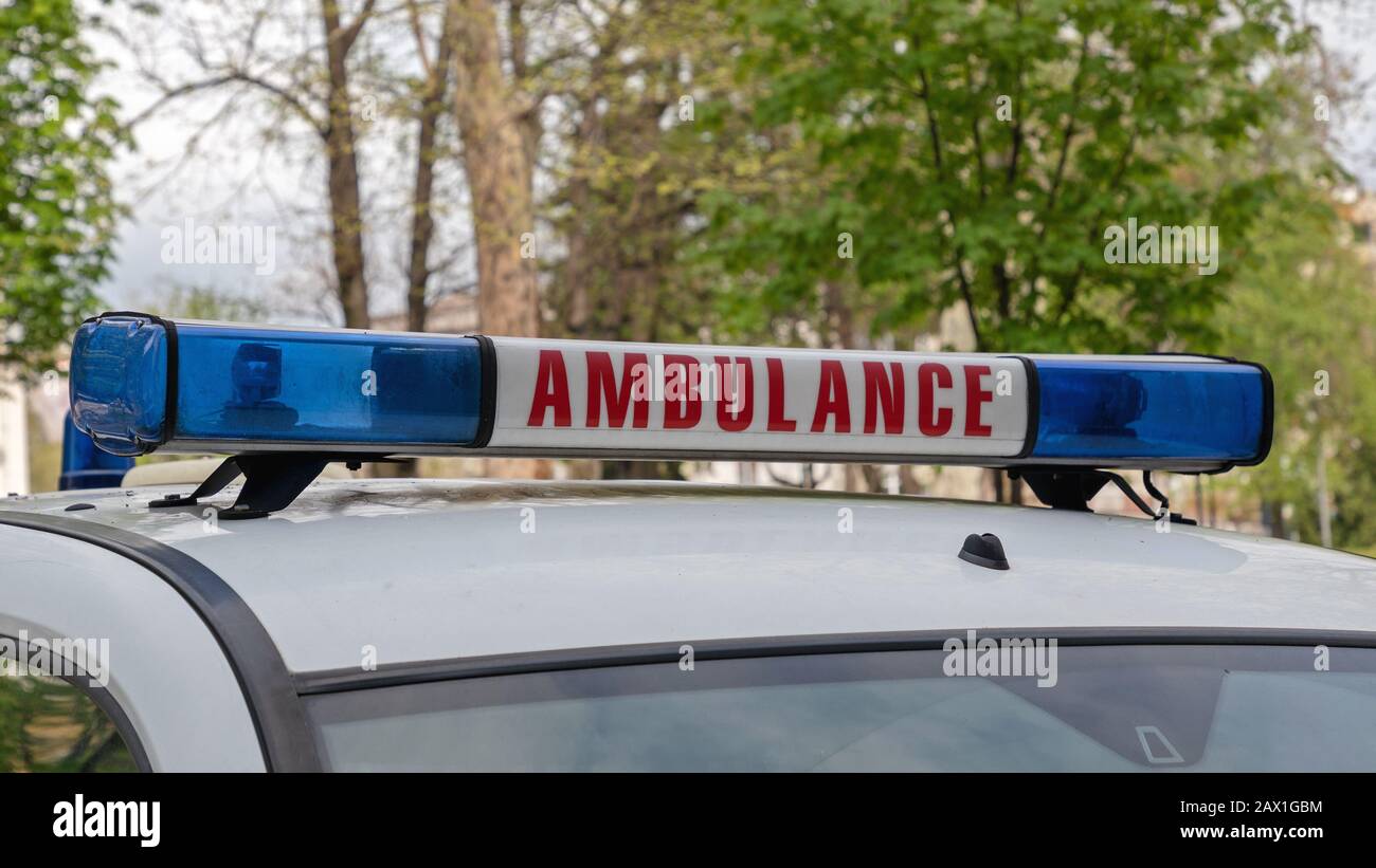 Ambulance Sign With Blue Lights Bar and Siren Stock Photo - Alamy
