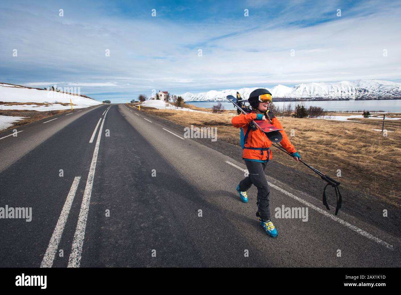 Woman walking along road in hi-res stock photography and images - Alamy