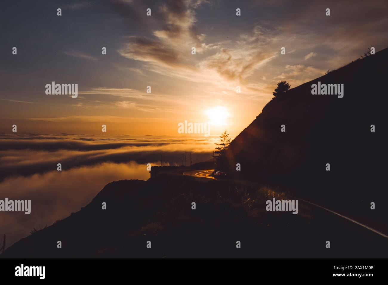 Highway 101 during sunset above clouds creating magical mood Stock ...