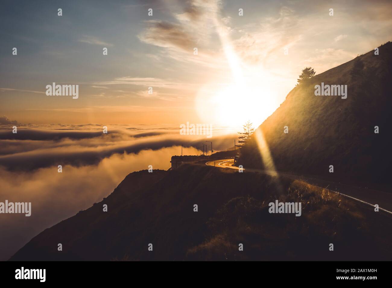 Shot of highway 101 during sunset above clouds Stock Photo - Alamy