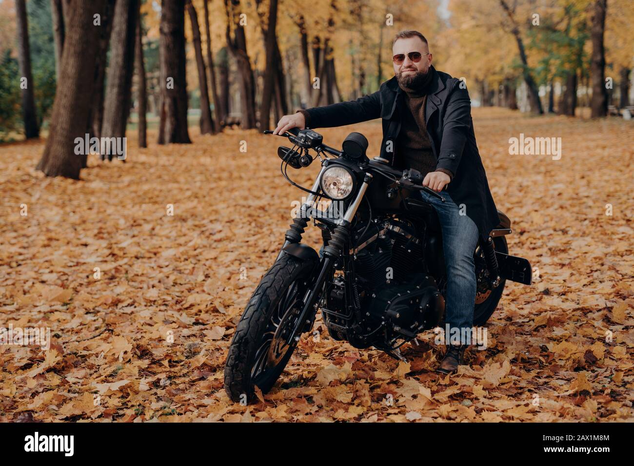 Travel, speed, freedom concept. Fashionable male motorcycle driver ...