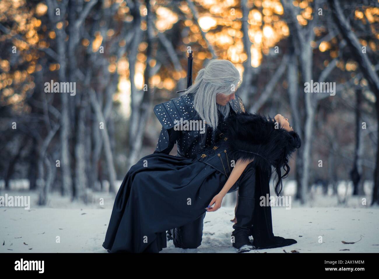 Cosplayers in image of ancient warrior witcher and witch portray a died ...