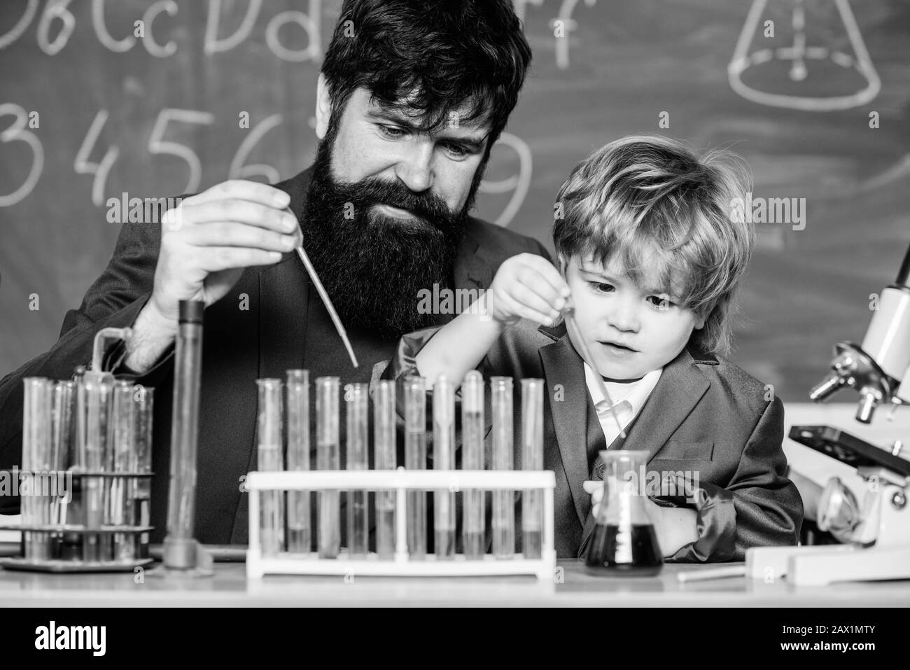 father and son at school. biotechnoloy research concept. Back to school ...