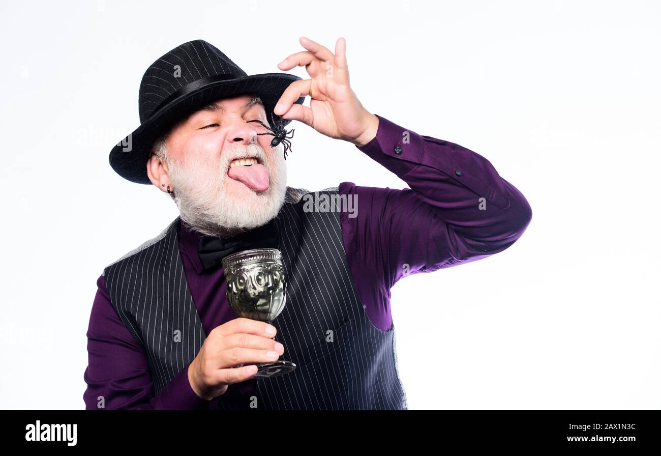 i am the treat. happy halloween. mature man magician in witch hat ...