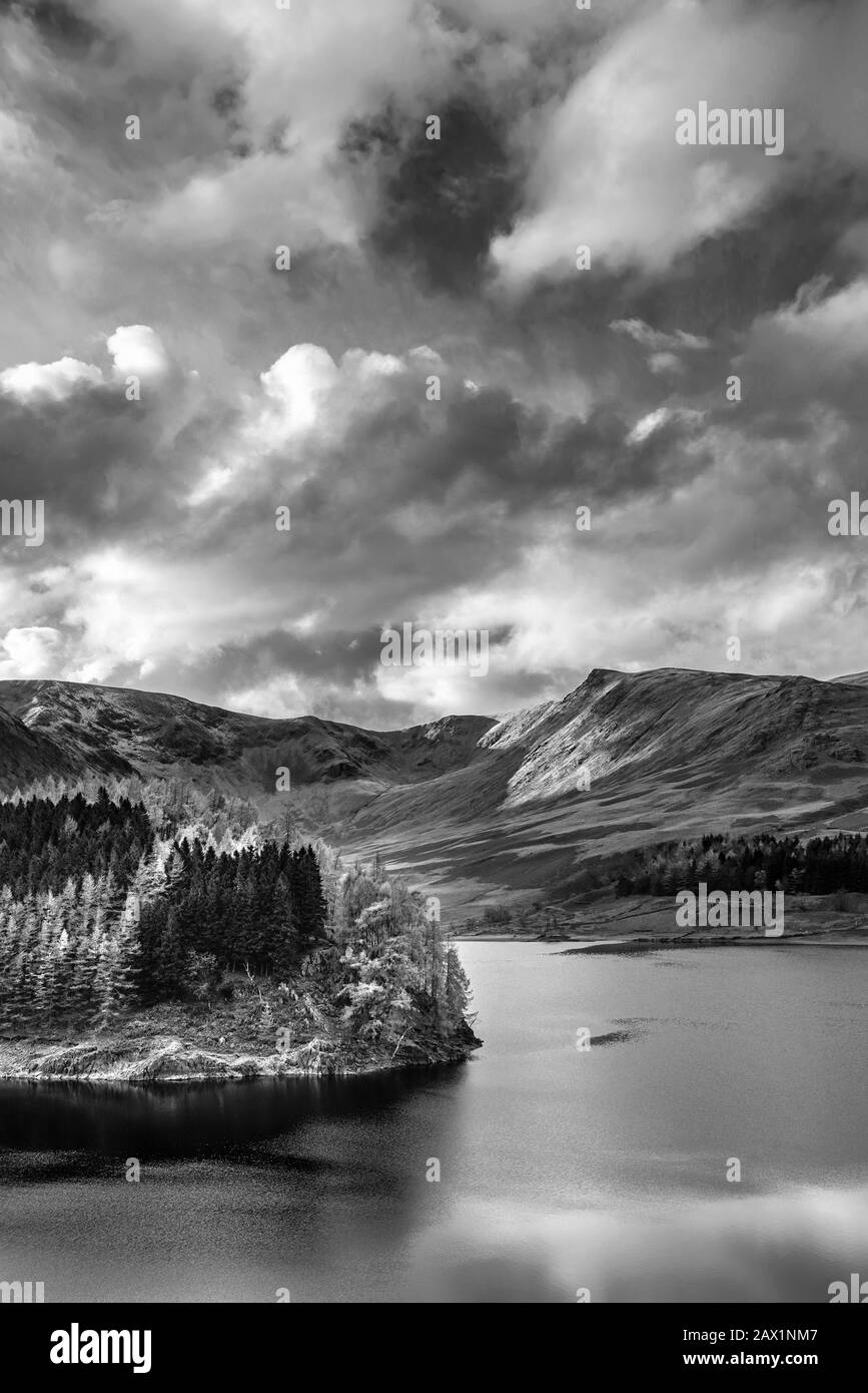Epic Autumn Fall landscape of Hawes Water with epic lighting and ...