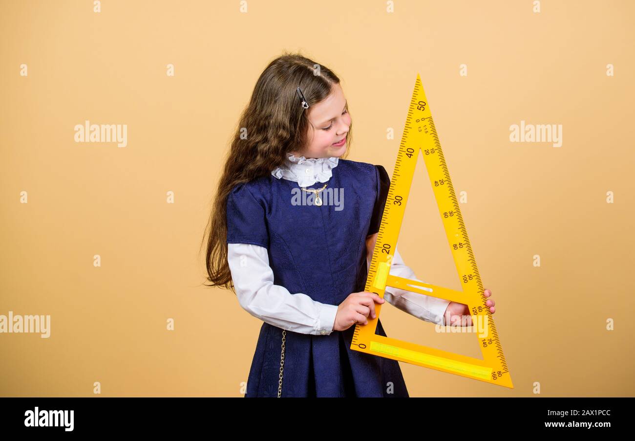 School student learning geometry. Pupil girl with big ruler. math ...