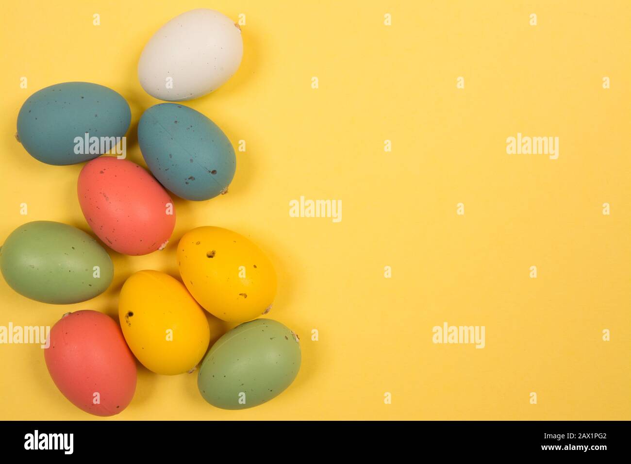 Easter holiday background. Coloured decorated easter eggs on a bright ...
