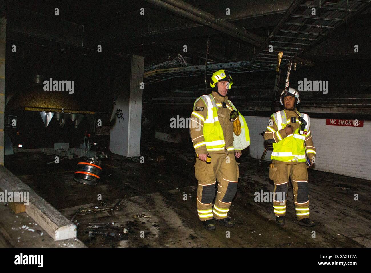 Firefighters at the scene of a fire in peckham hi-res stock photography ...