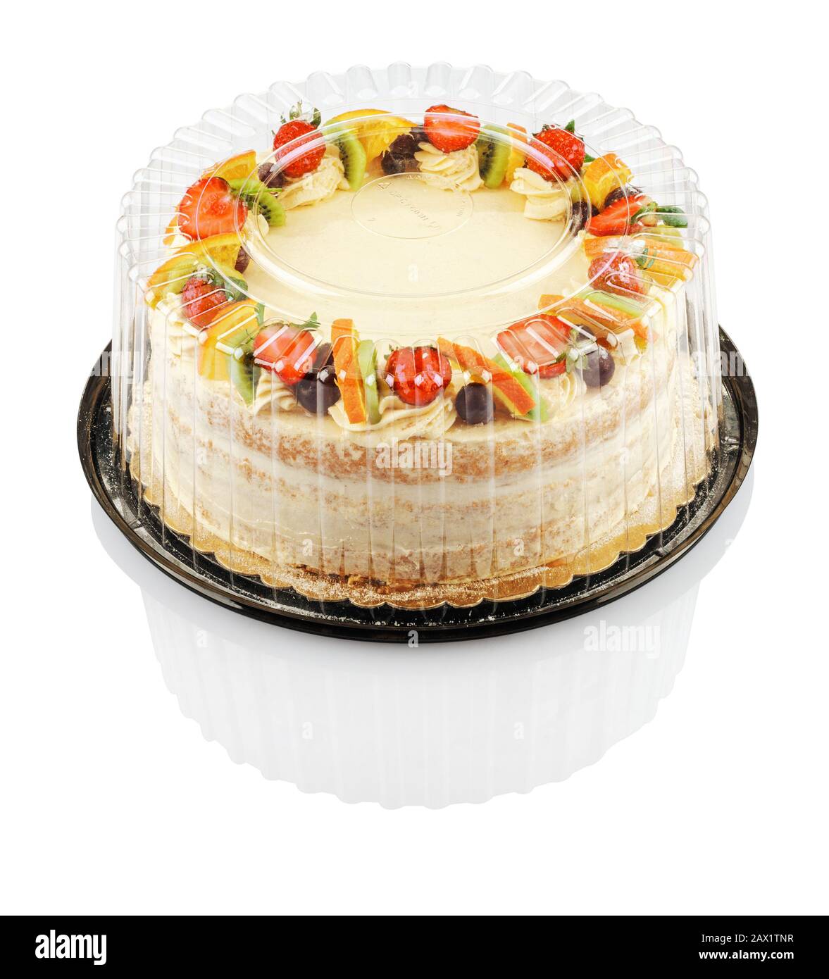 round cake with fruit and berries in a plastic container isolated on a ...