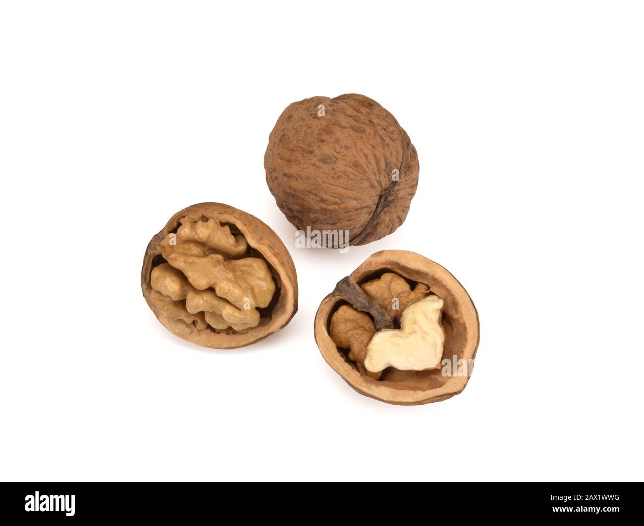 walnut and a cracked walnut isolated on white background Stock Photo ...