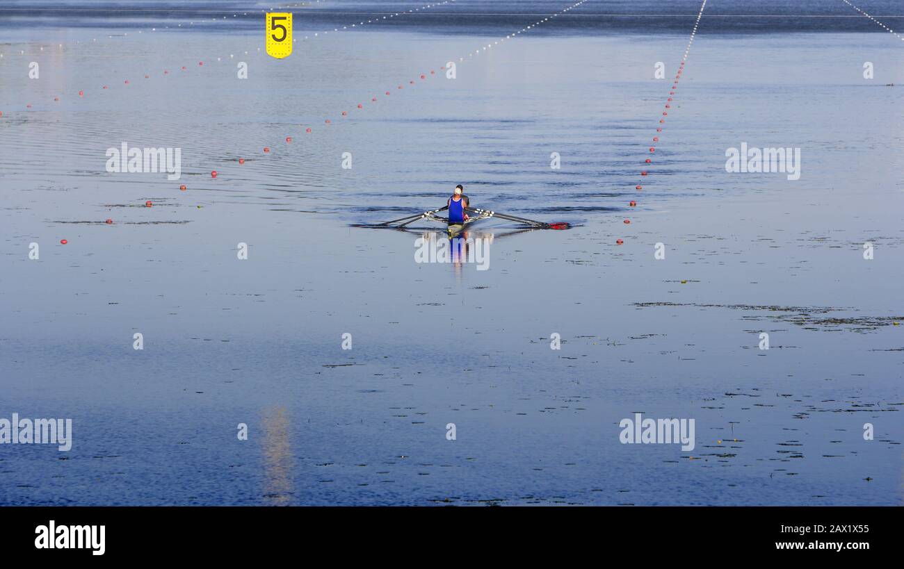 Two man in a sports boat rowing on the lake Stock Photo - Alamy
