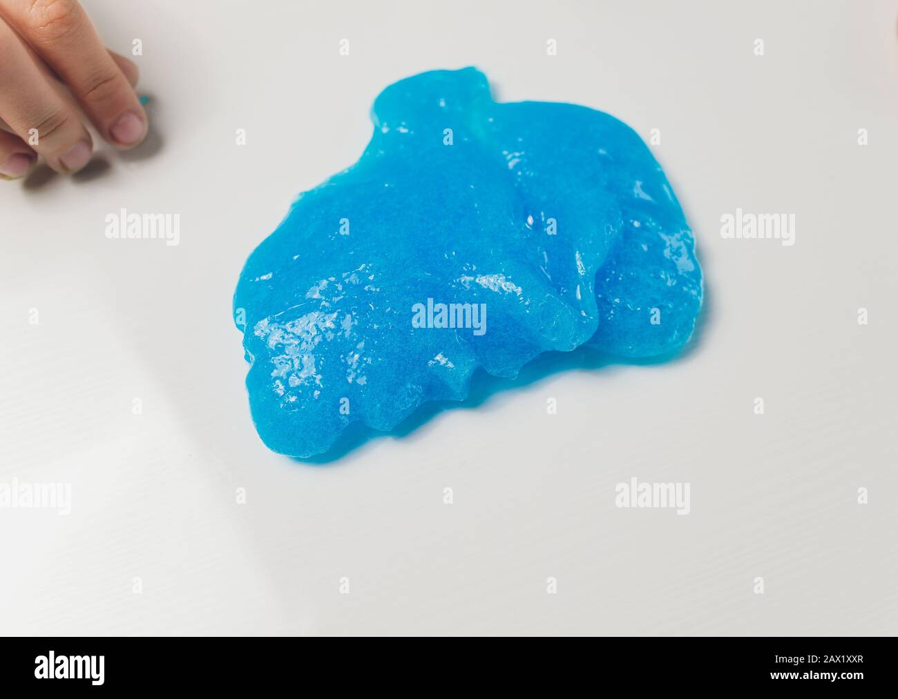 Kid Playing Hand Made Toy Called Slime Alien drool Shell mussel Stock ...