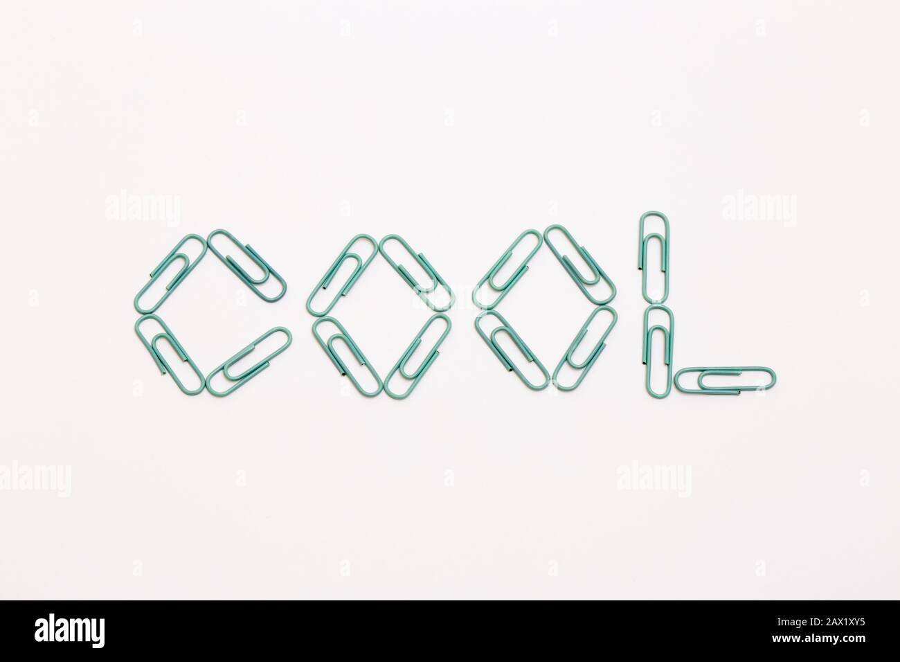 cool shaped green paperclips on white background Stock Photo - Alamy