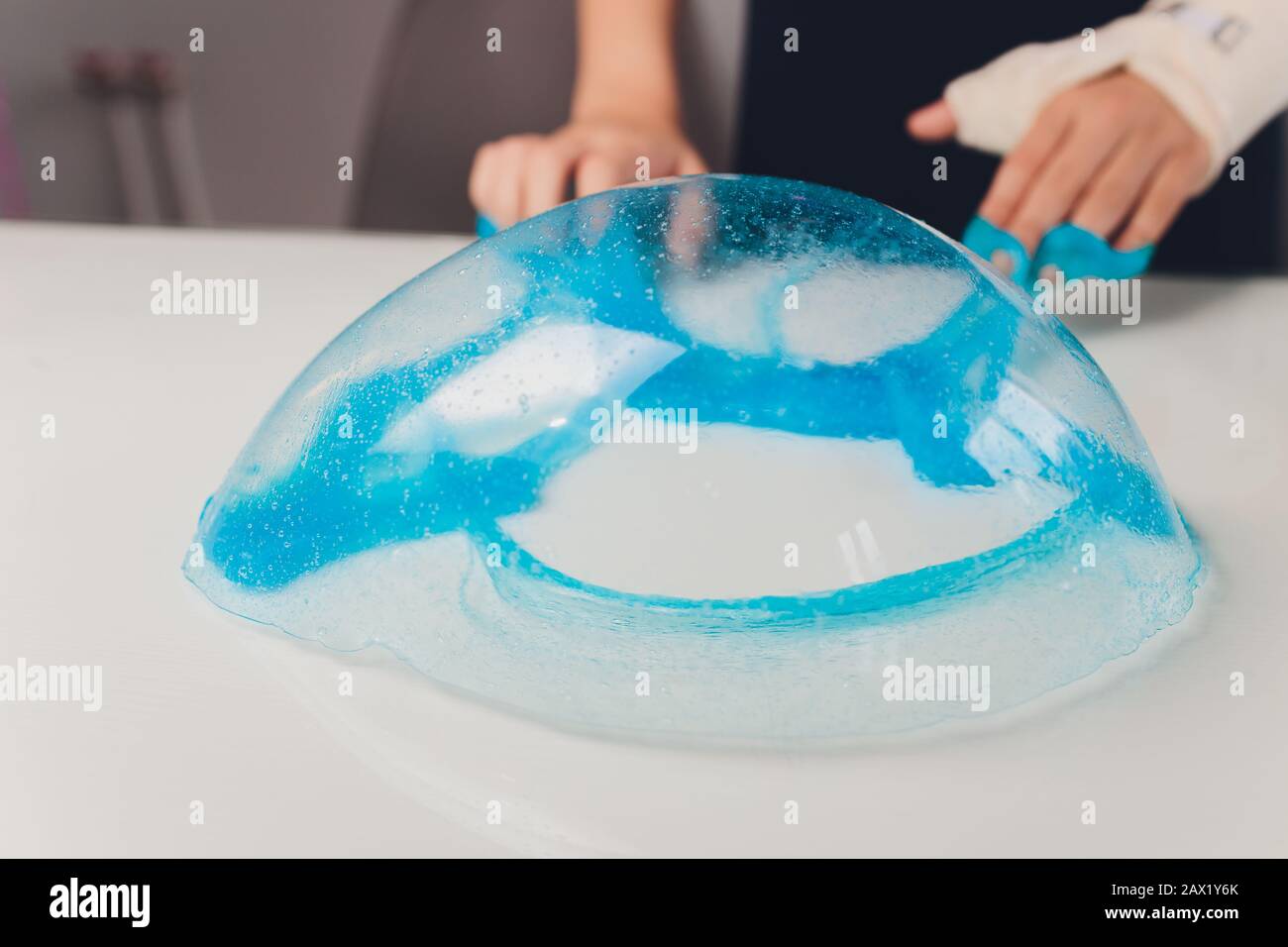 Kid Playing Hand Made Toy Called Slime Alien drool Shell mussel ...