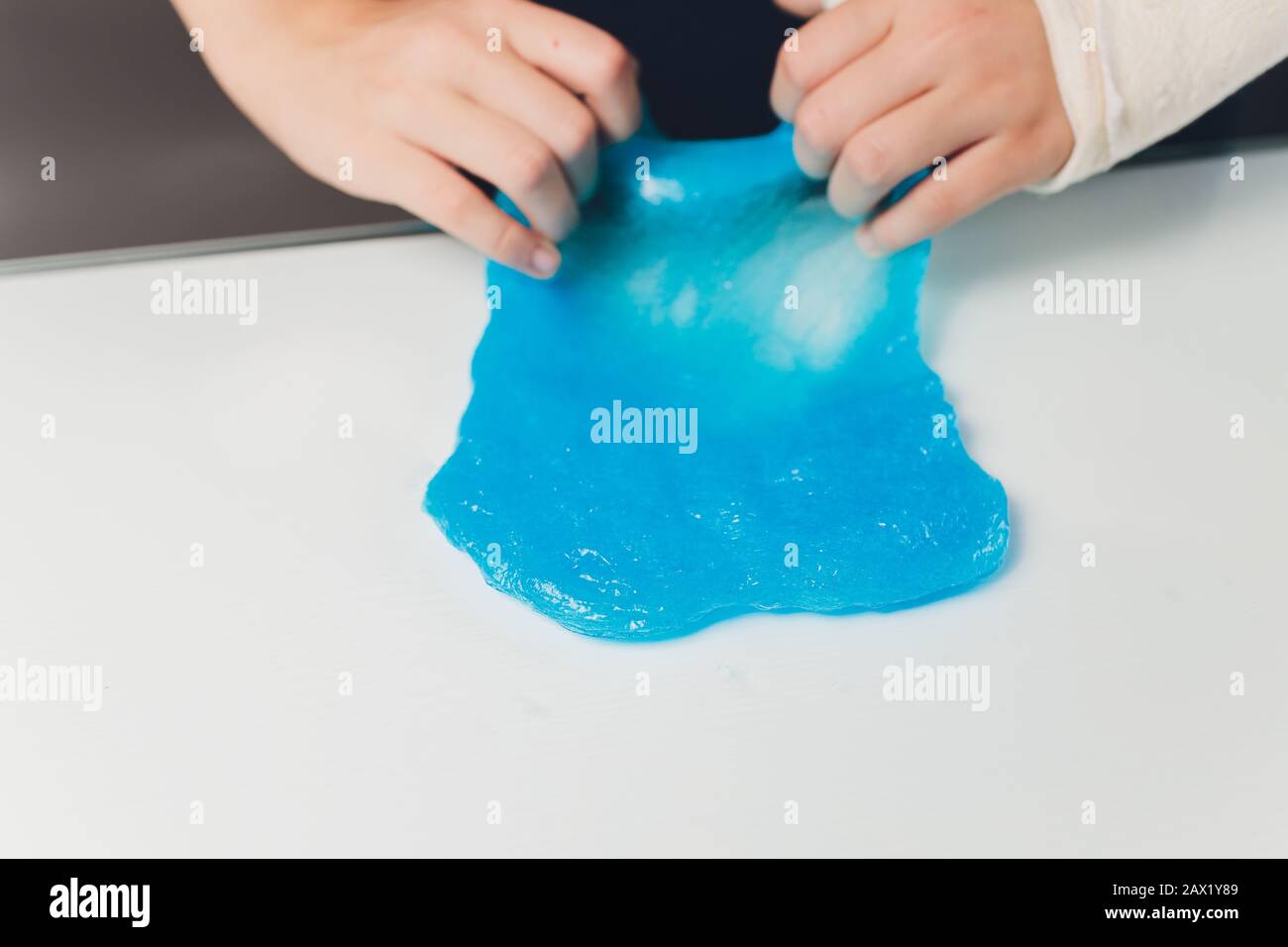 Kid Playing Hand Made Toy Called Slime Alien drool Shell mussel ...