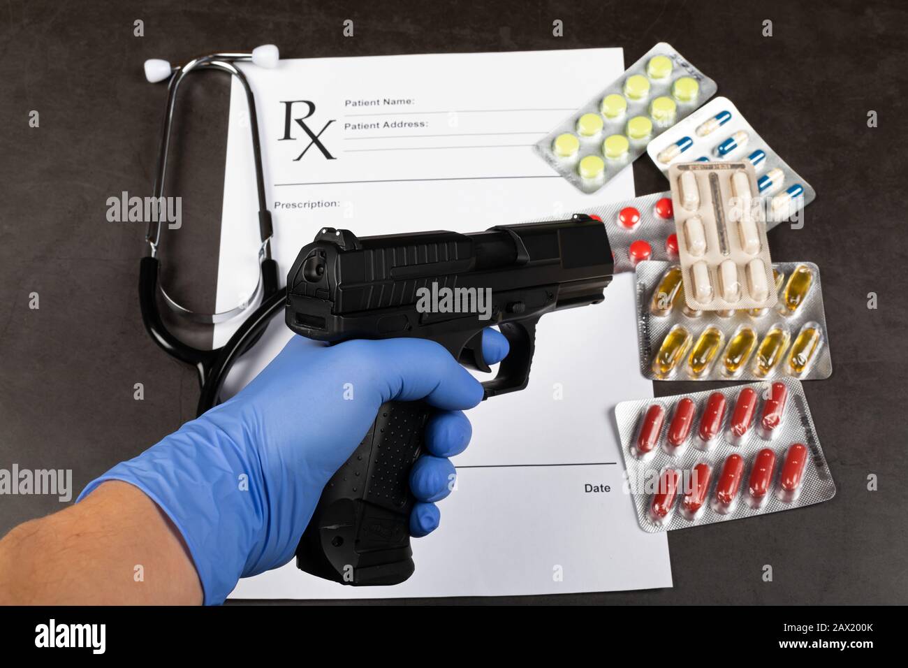 Doctor's hand pointing a gun over medical prescription Stock Photo - Alamy