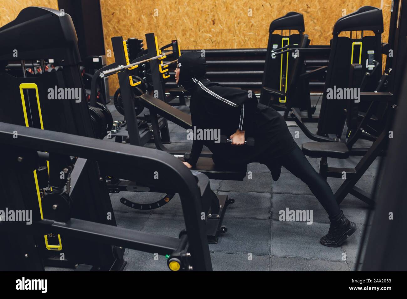 Muslim asian woman in hijab exercizing in a gym Stock Photo - Alamy