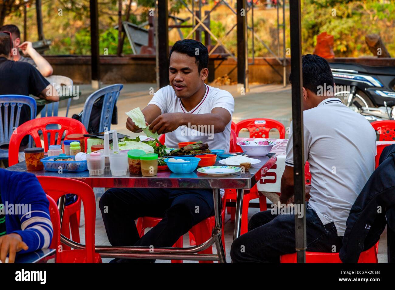 Local People Eating At A Riverside Restaurant, Battambang, Cambodia ...