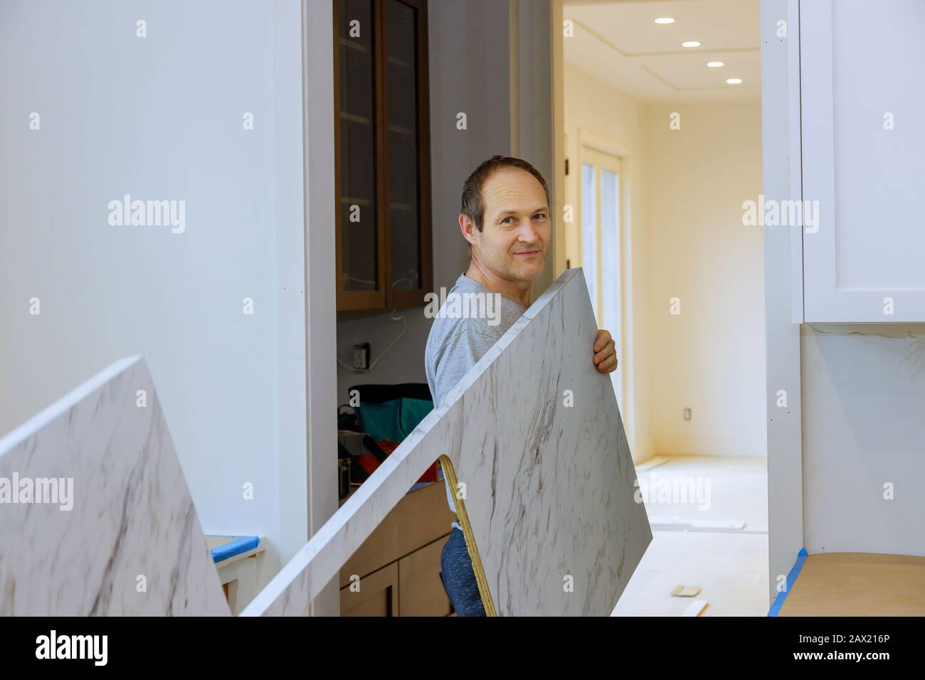 Kitchen counter top in a kitchen carpenter installing cabinets more ...