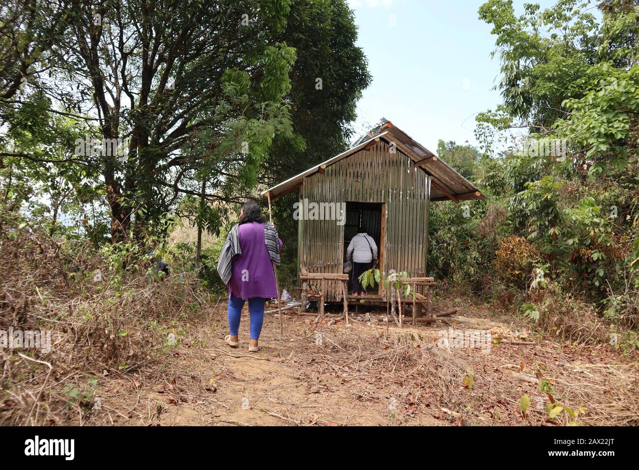Two senior women from the Philippines, visiting their little house in ...