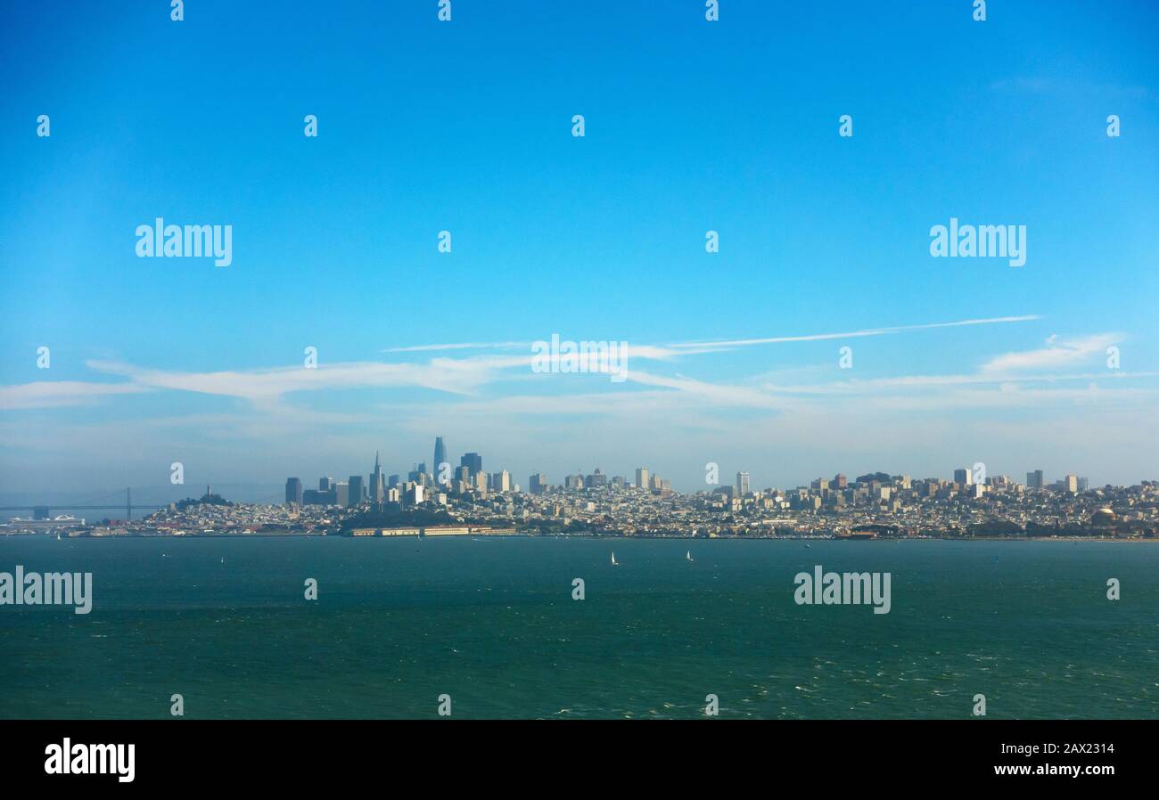 Modern coastal city skyline with blue sky Stock Photo - Alamy