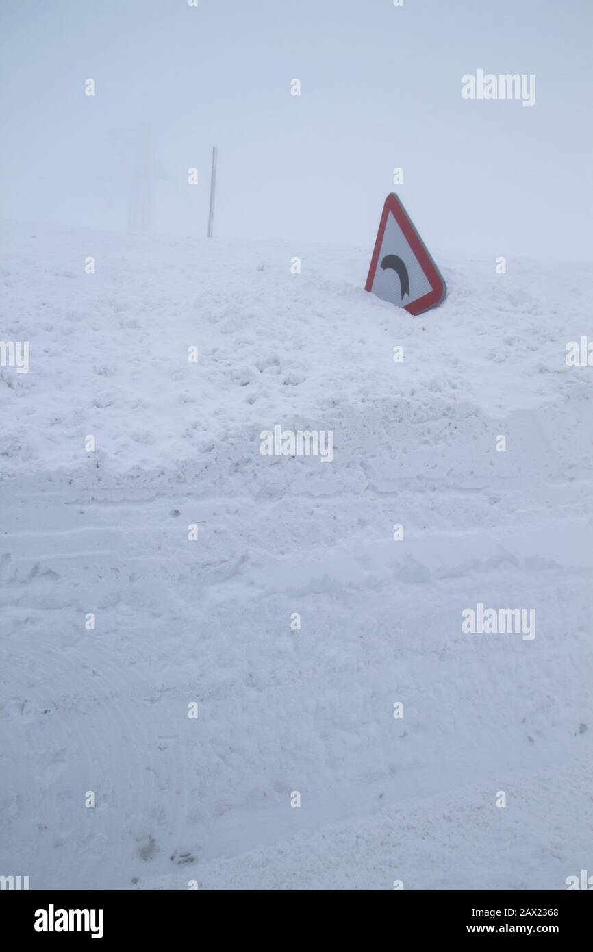 Traffic signs buried in the snow Stock Photo - Alamy