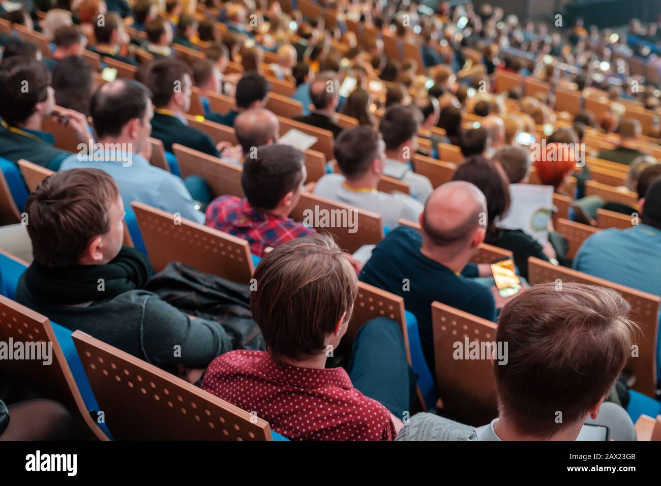 Business conference attendees sit and listen Stock Photo - Alamy