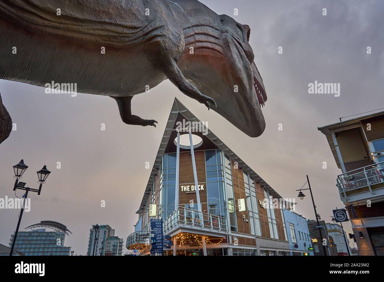 A large, animated dinosaur on display at Mermaid Quay, Cardiff Bay in ...