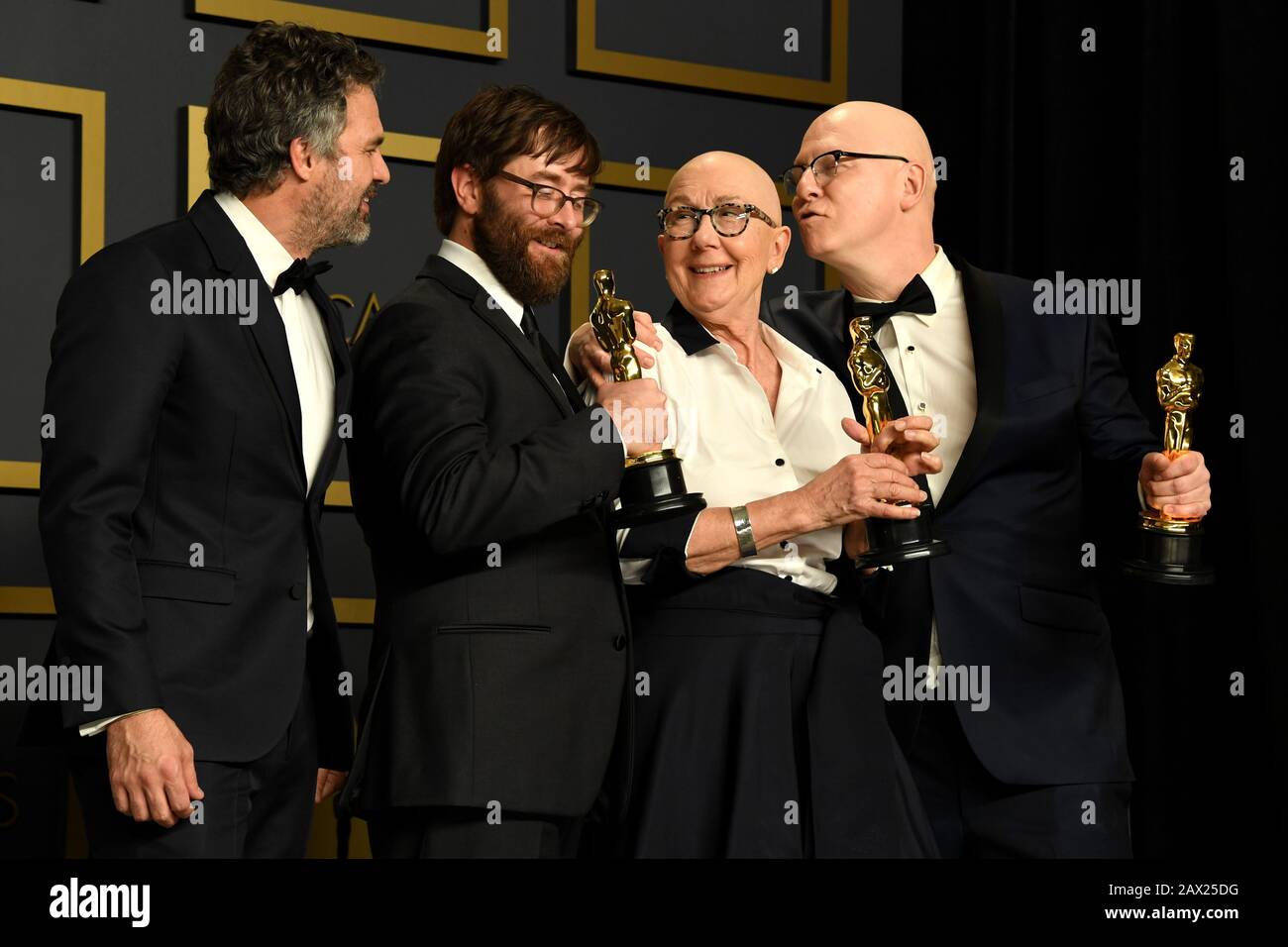 Steven Bognar, Julia Reichert and Jeff Reichert (left to right) accept ...