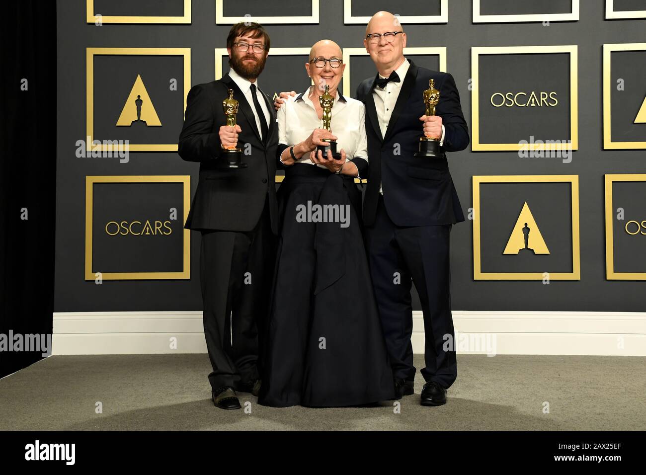 Jeff Reichert, Julia Reichert, and Steven Bognar pose in the press room ...