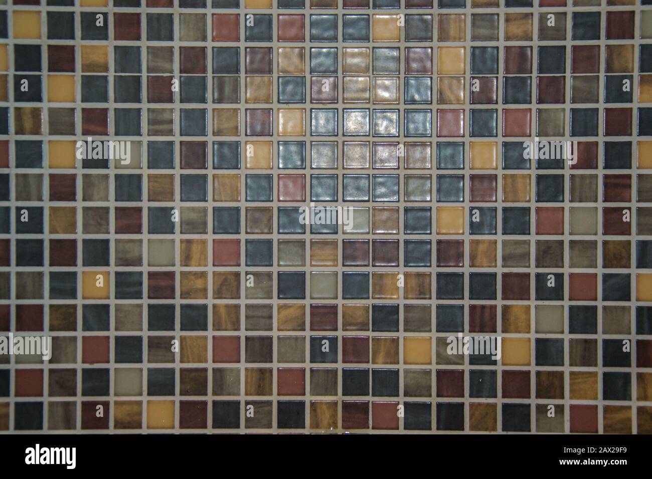 Mosaic of small square tiles in brown, beige and amber colors, colorful ...