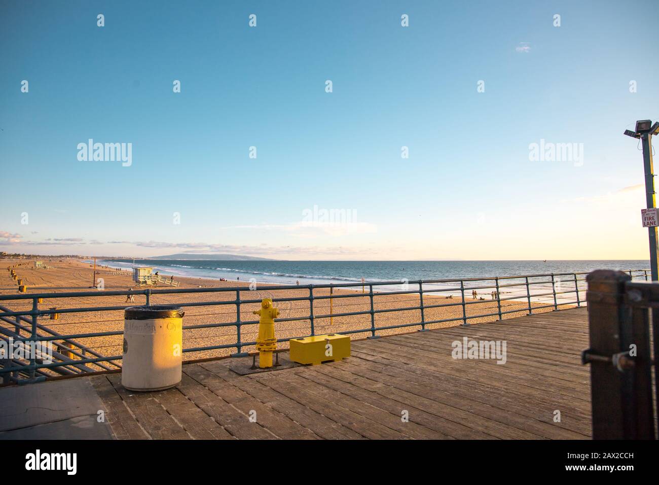 Santa monica pier sunset sun with the sea background Stock Photo - Alamy
