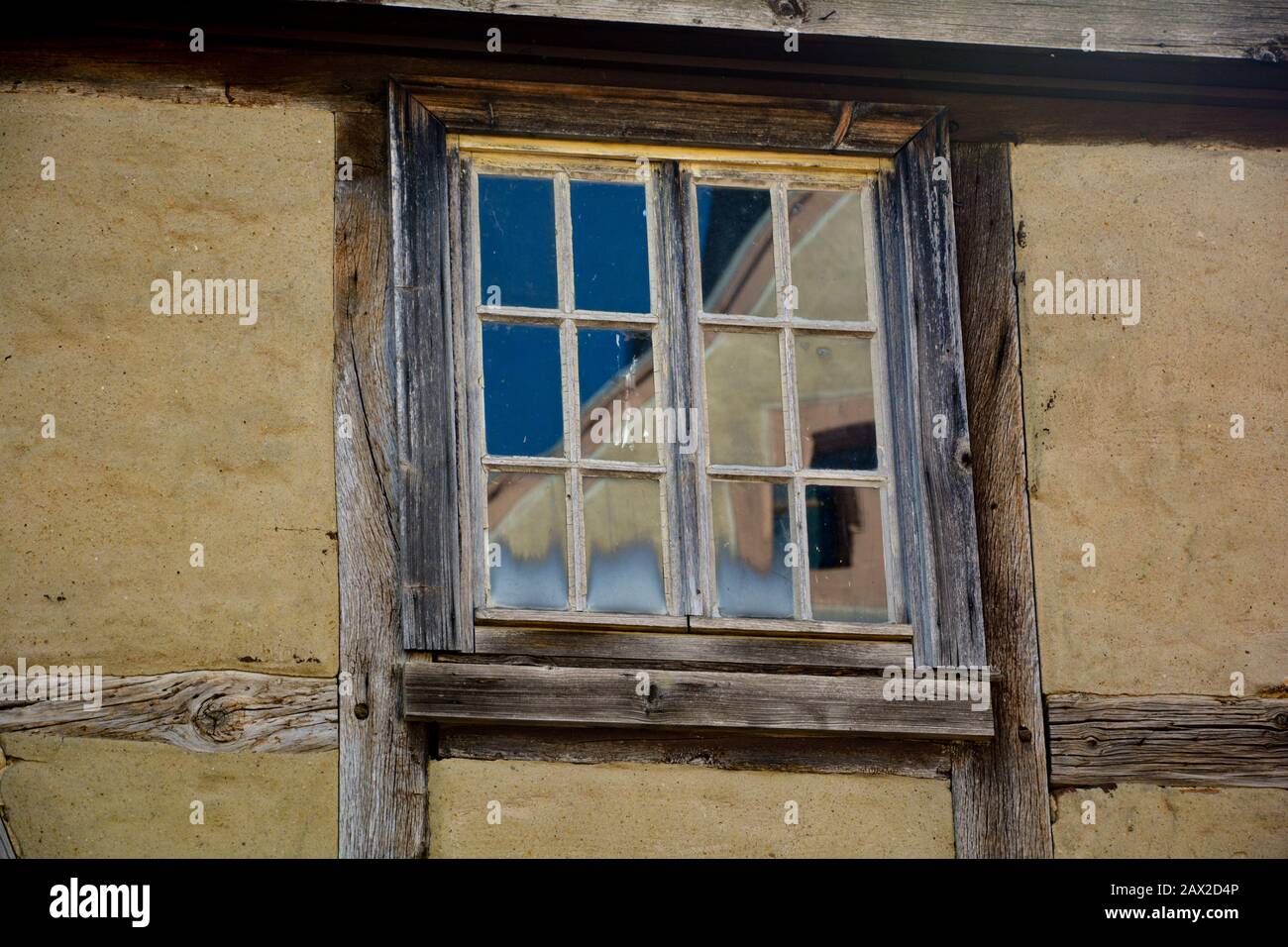 Old window with wooden frame and reflection at an old castle in Germany ...