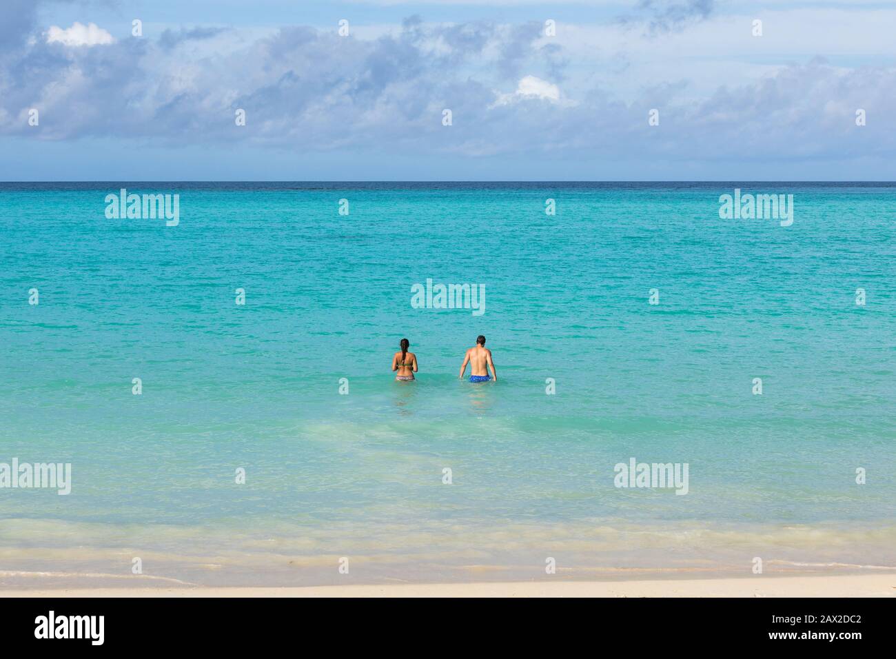 Young Couple swimming in blue lagoon bounty atoll. seashore paradise ...