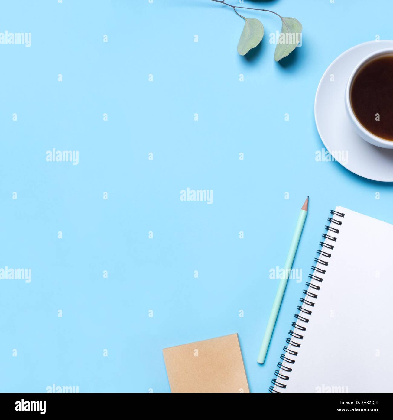 Blue background with notepad, pencil and cup of coffee Stock Photo - Alamy