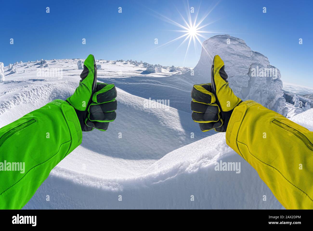 hand shows thumbs up against winter landscape Stock Photo - Alamy